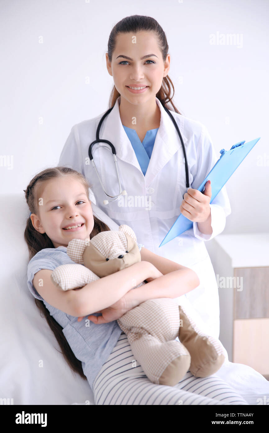 Cute girl visiting doctor Stock Photo - Alamy