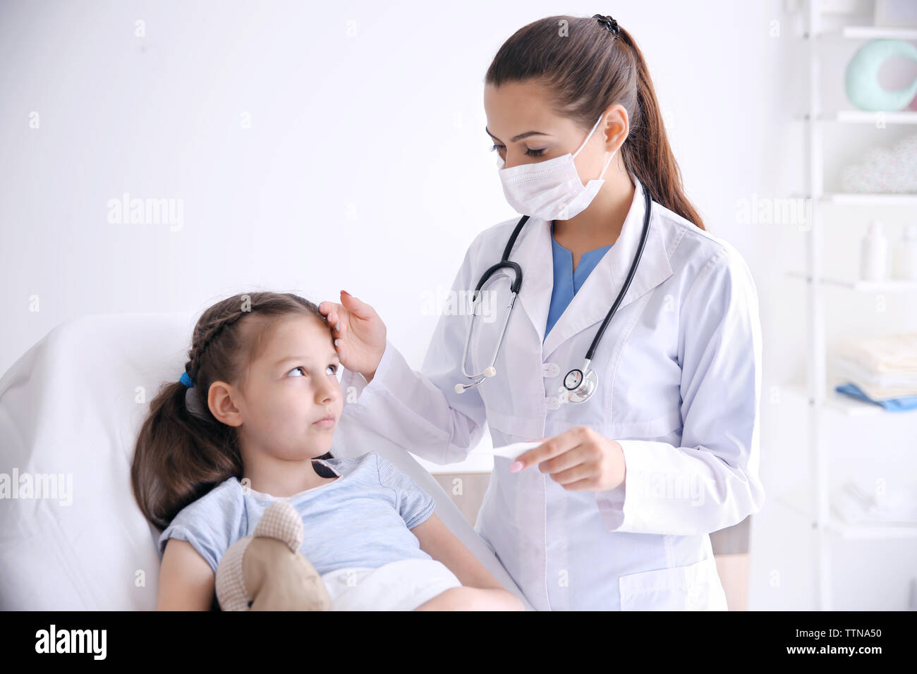 Cute girl visiting doctor Stock Photo - Alamy