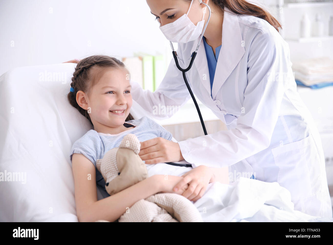 Cute girl visiting doctor Stock Photo - Alamy