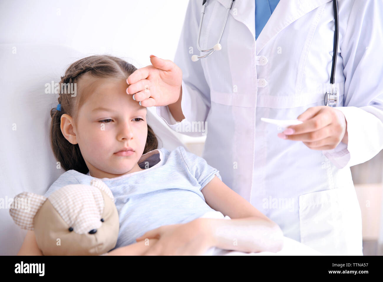 Cute girl visiting doctor Stock Photo - Alamy
