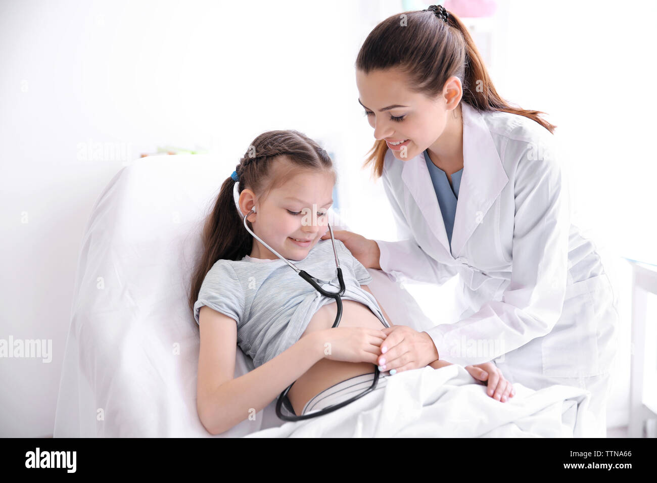 Cute girl visiting doctor Stock Photo - Alamy