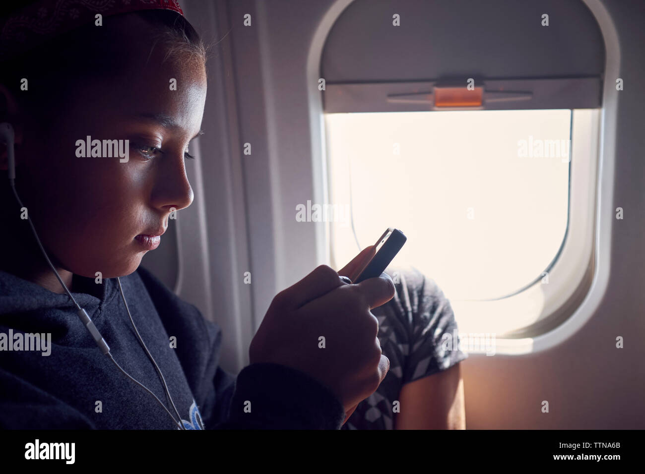 Child using mobile in public hi-res stock photography and images - Alamy