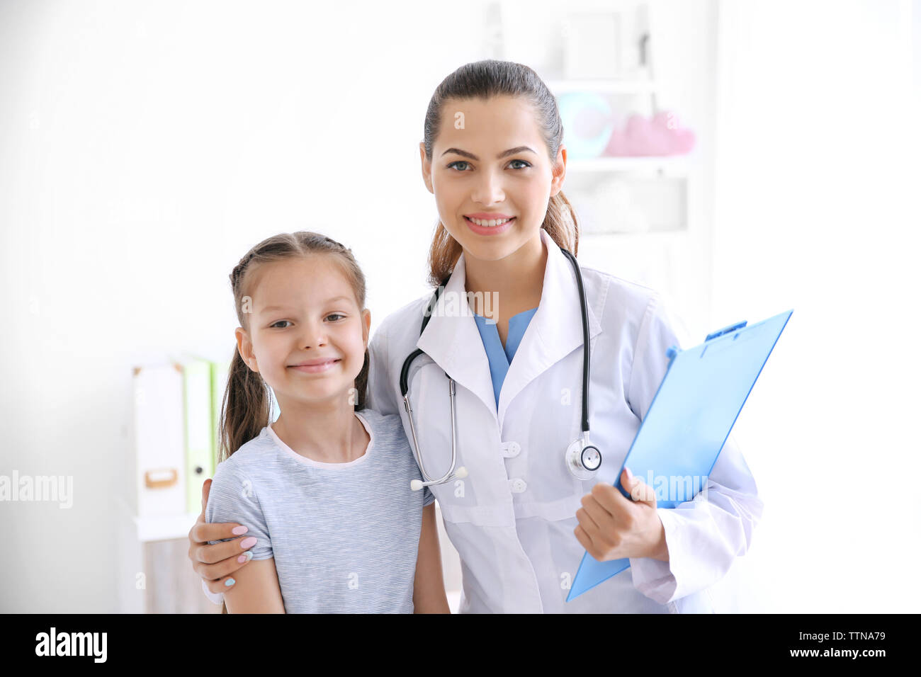 Cute girl visiting a doctor Stock Photo - Alamy