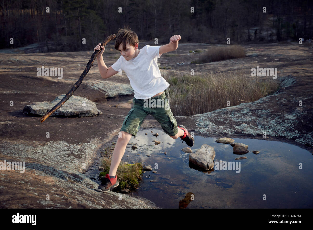 Jumping over puddle hi-res stock photography and images - Alamy