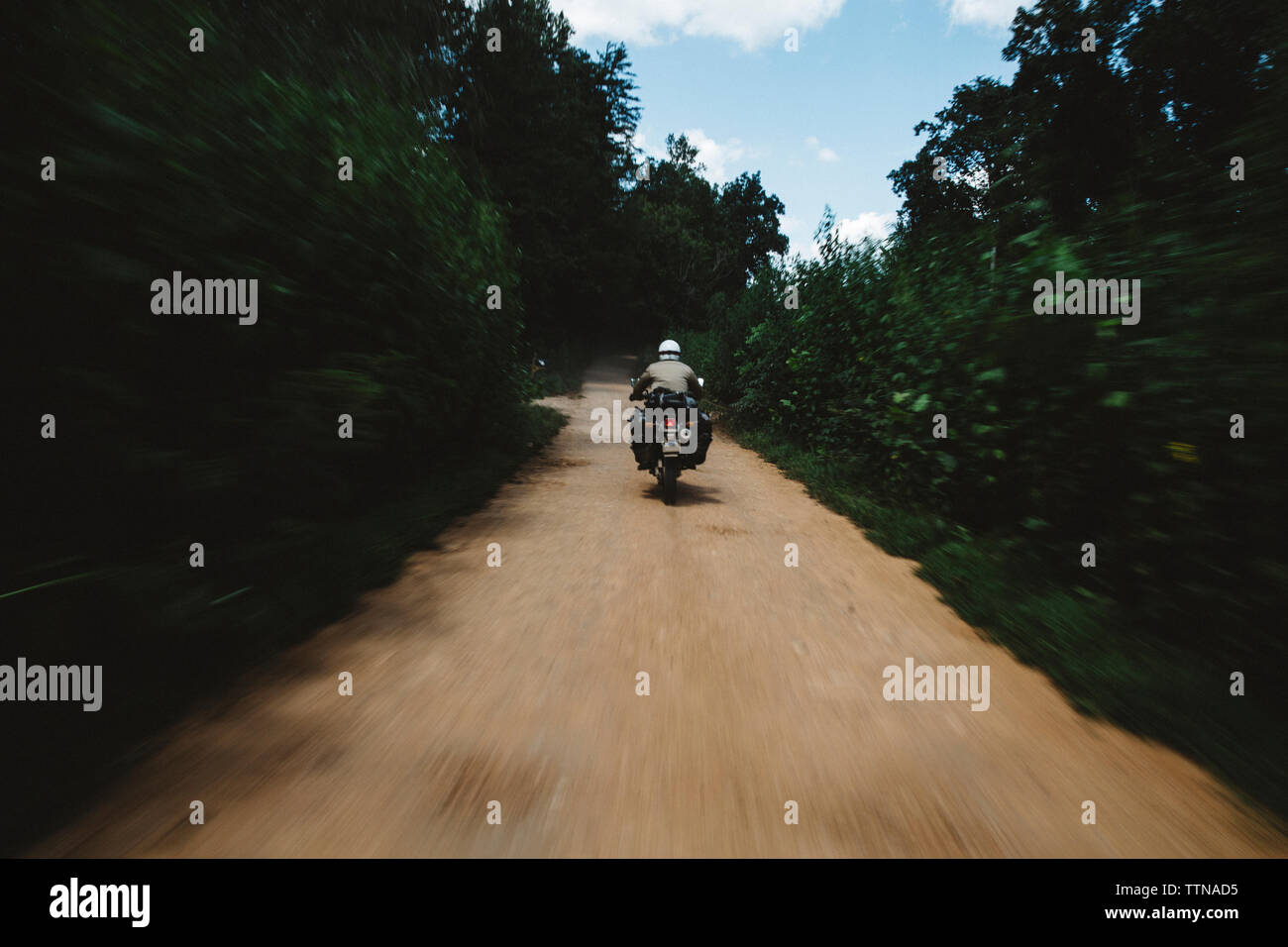 Rear view riding motorcycle hi-res stock photography and images - Alamy
