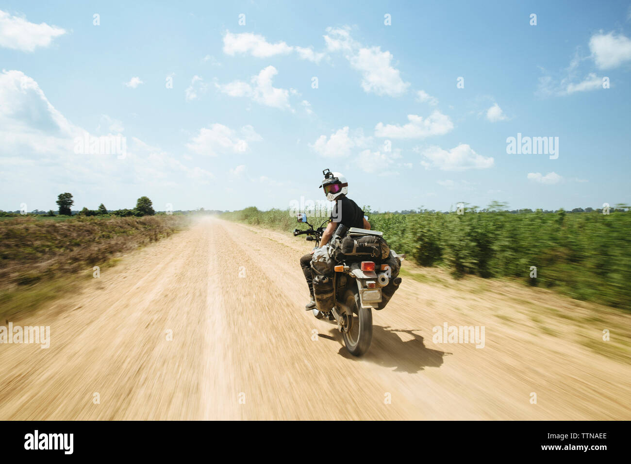 Rear view riding motorcycle hi-res stock photography and images - Alamy