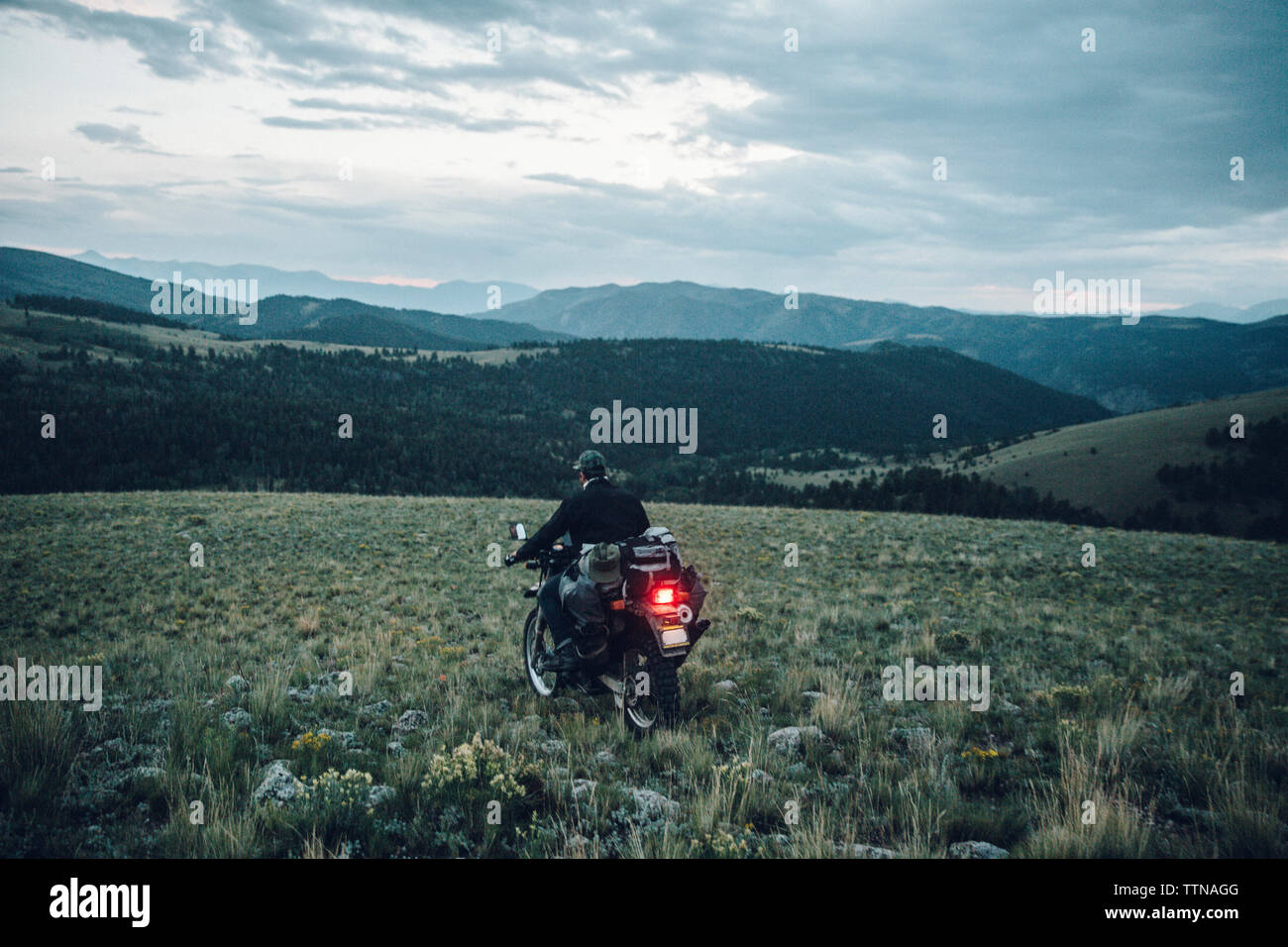 Rear view riding motorcycle hi-res stock photography and images - Alamy