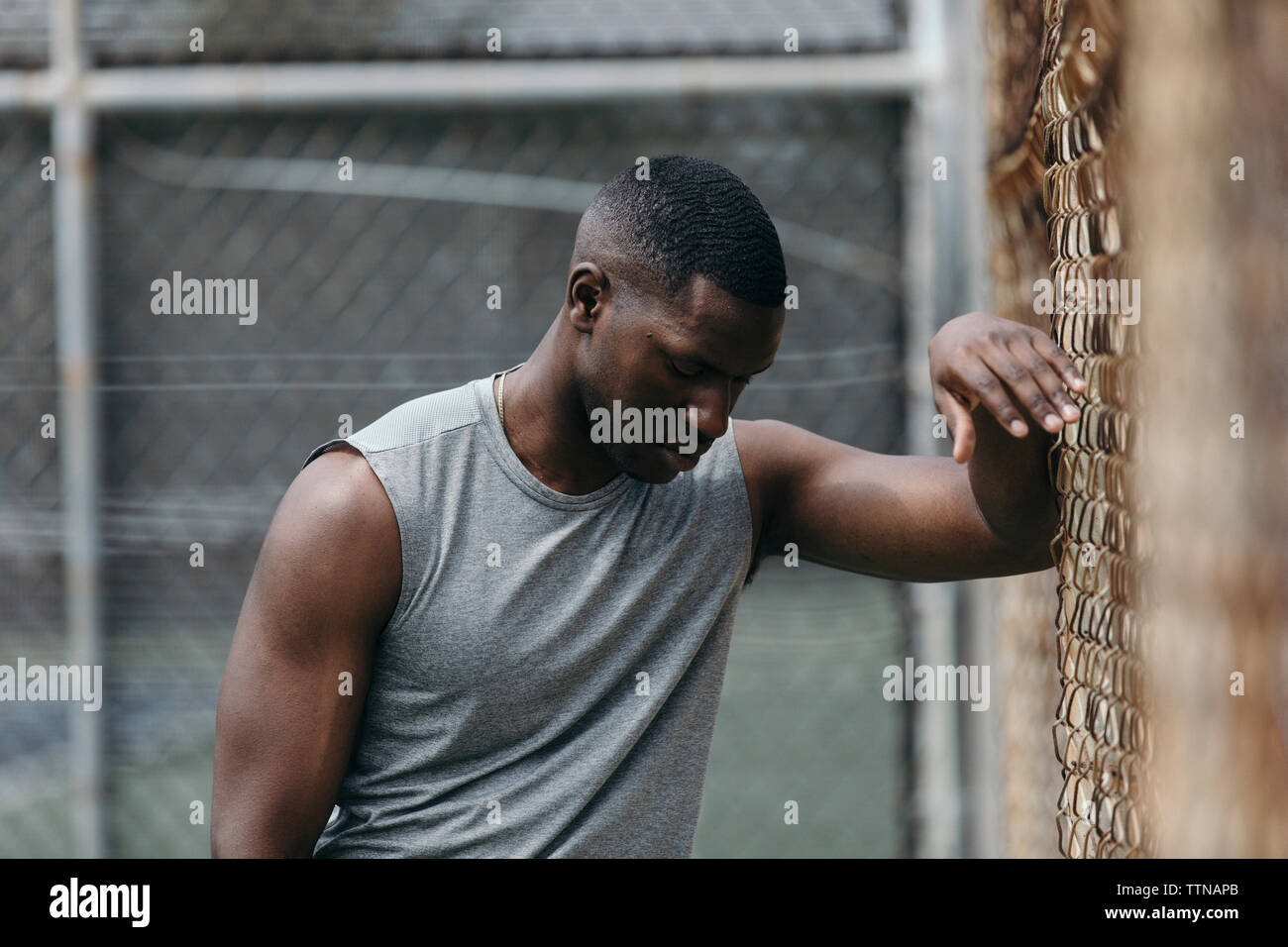 Old man leaning fence hi-res stock photography and images - Alamy