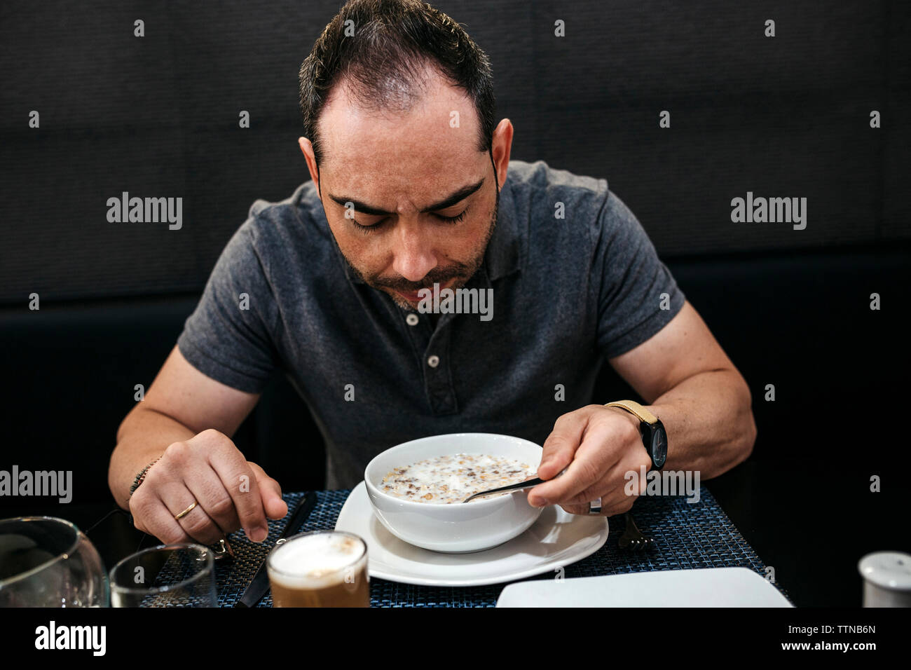 Mature man sitting restaurant hi-res stock photography and images - Alamy