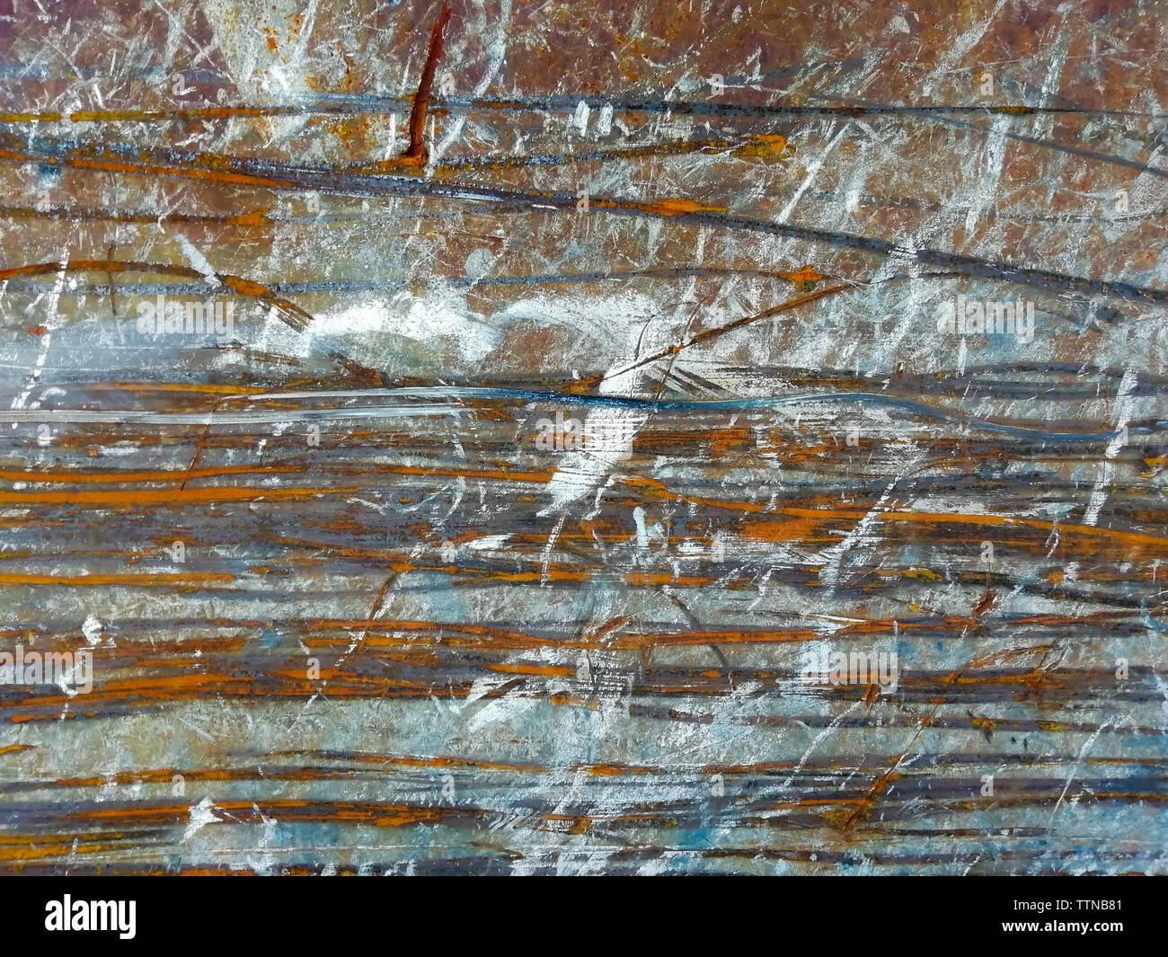 Rusty metal background with rust streaks and white spots. Material worn ...