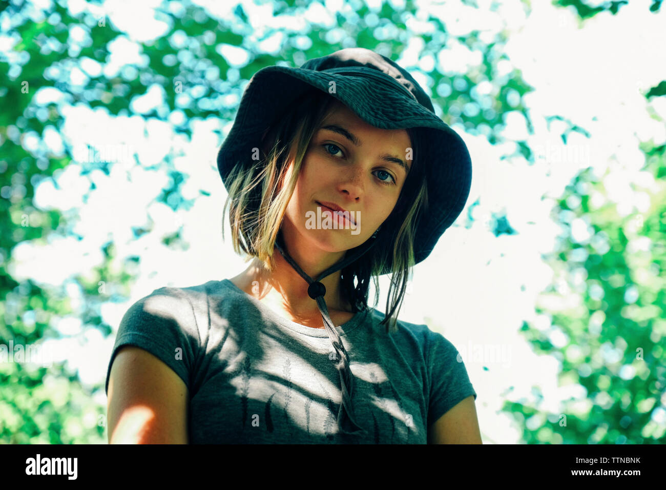 Low angle woman and trees hi-res stock photography and images - Alamy