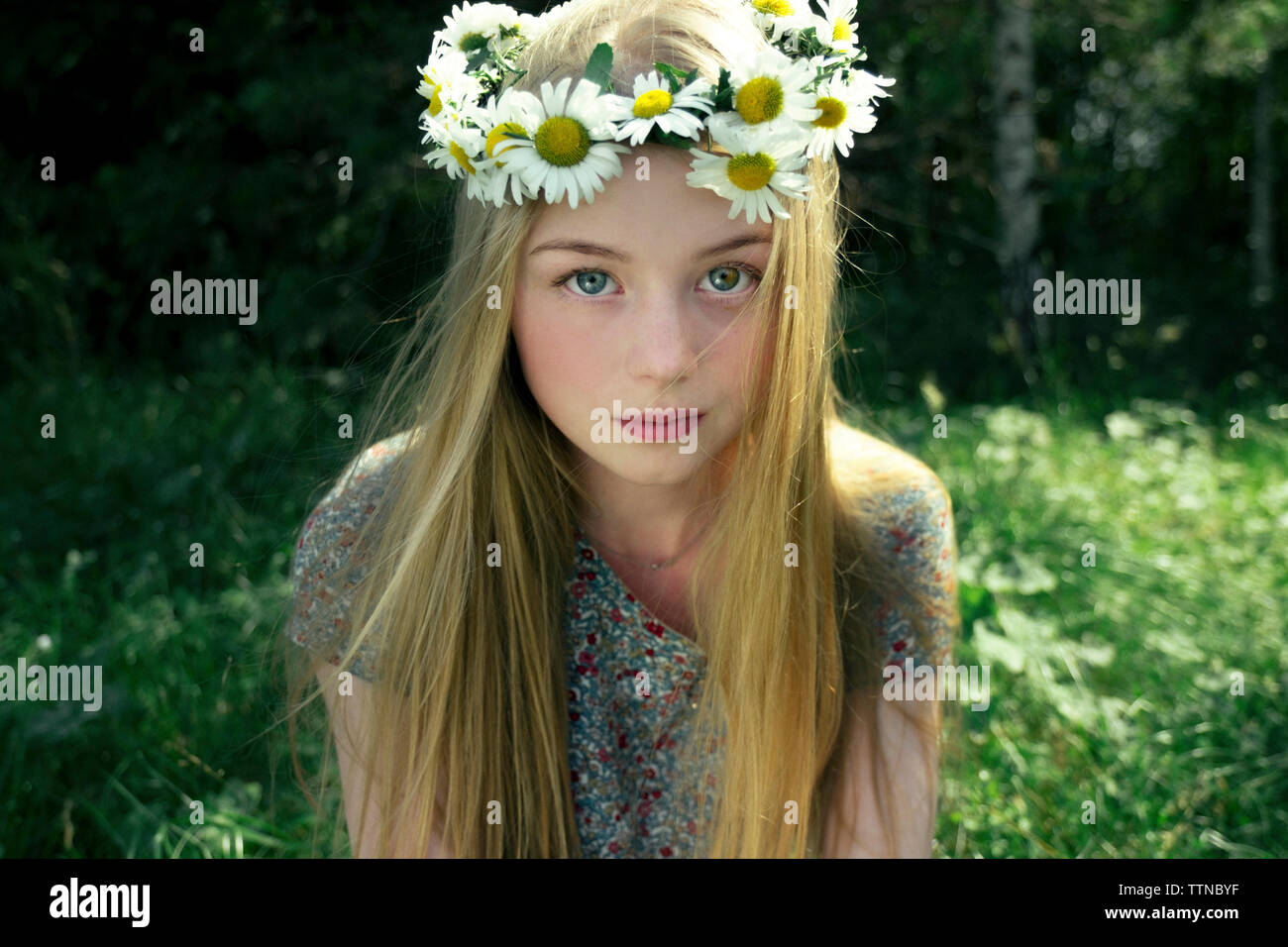 Young woman wearing flowers hi-res stock photography and images - Alamy