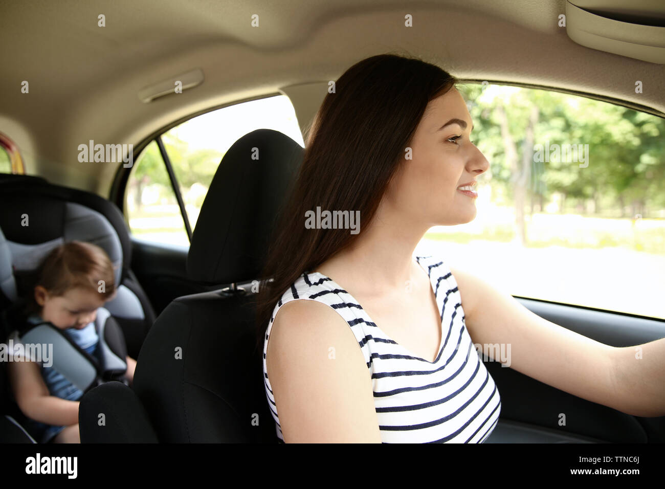 Mother baby driving in car hi-res stock photography and images - Alamy