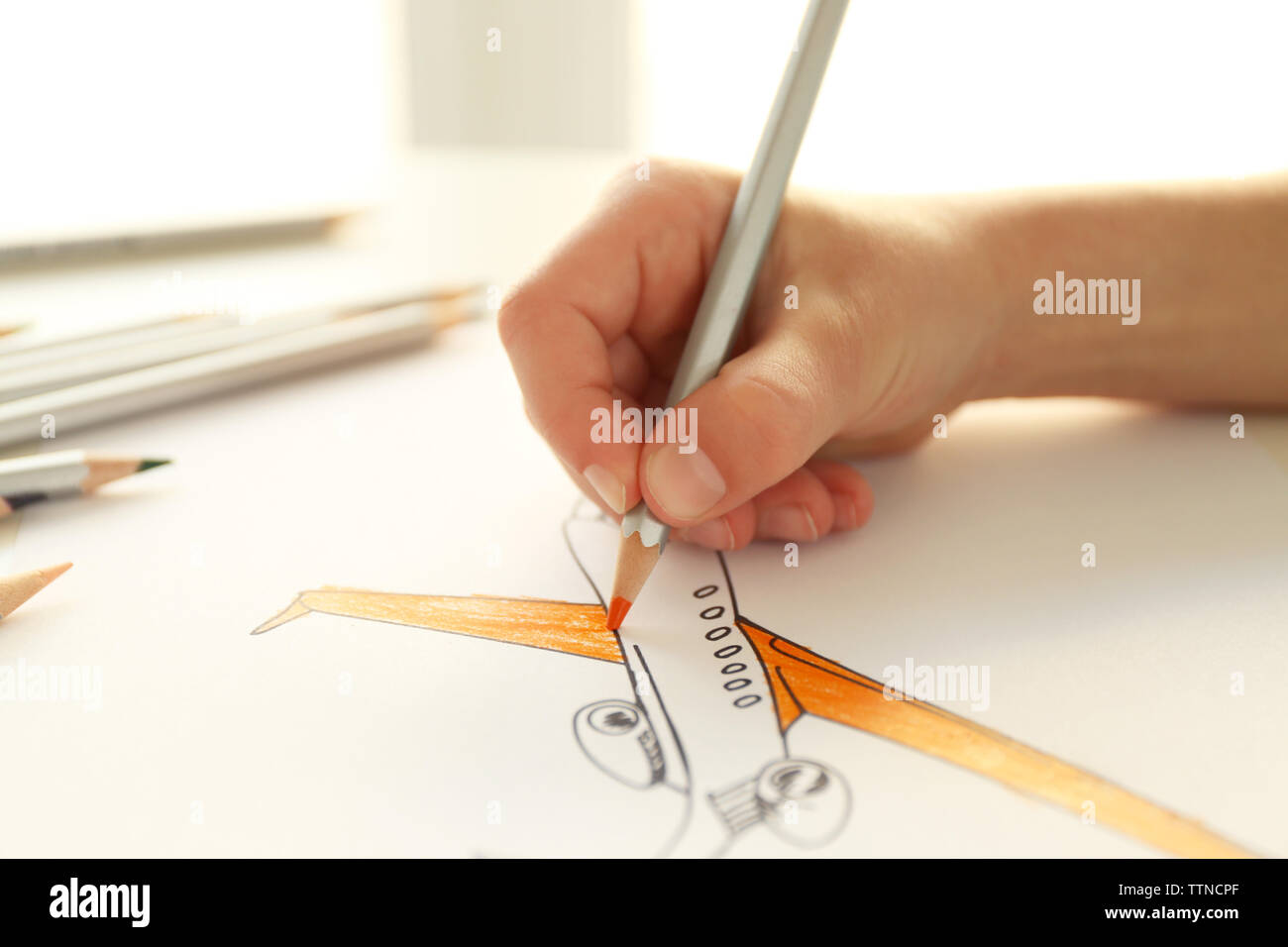 Child's hand drawing picture on paper Stock Photo - Alamy