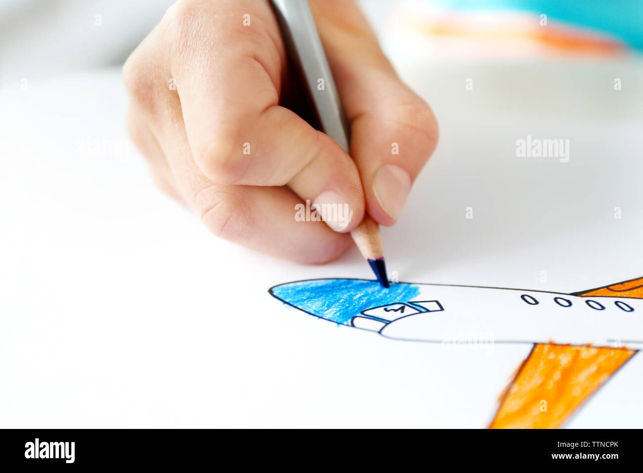 Child's hand drawing picture on paper Stock Photo - Alamy