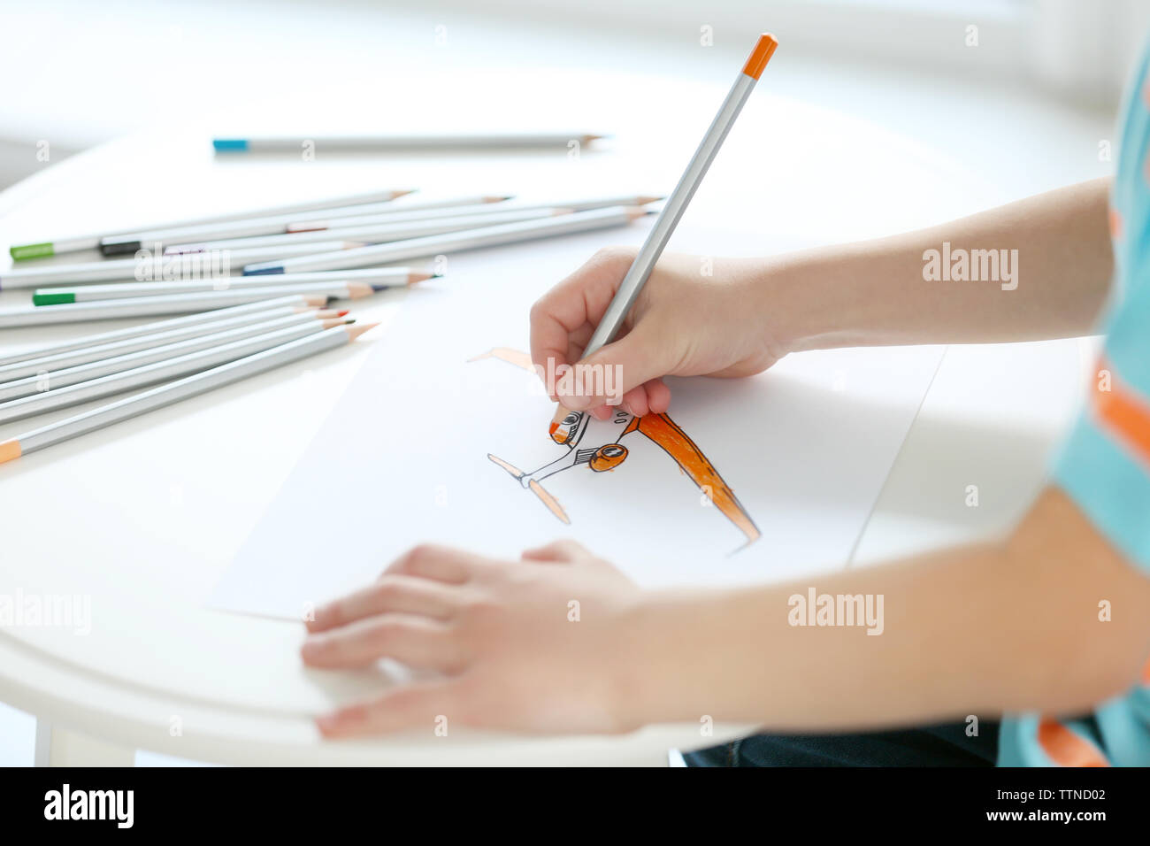 Child's hands drawing picture on paper Stock Photo - Alamy