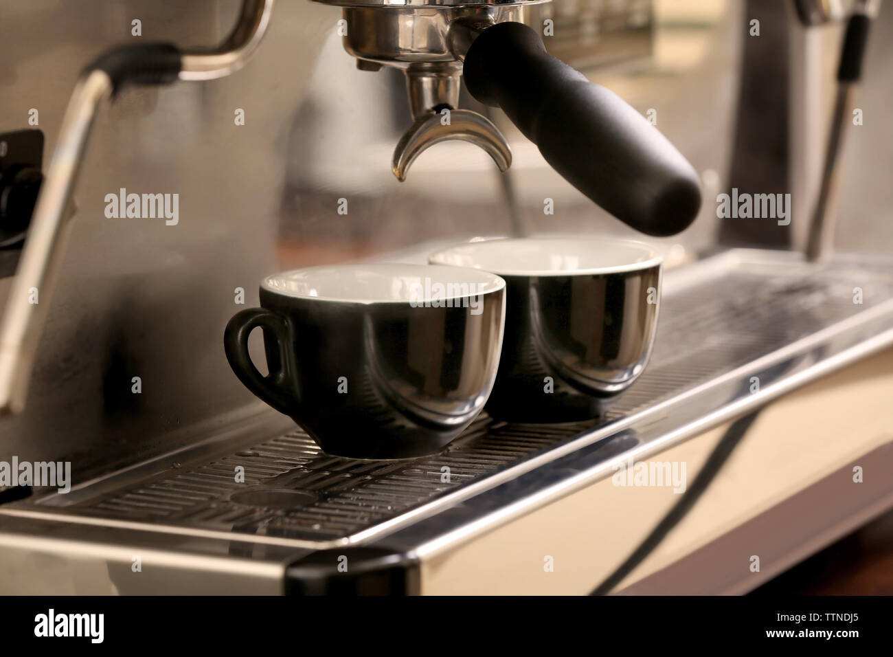 Automatic coffee machine preparing espresso Stock Photo - Alamy