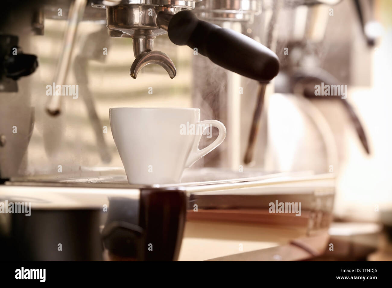 Automatic coffee machine preparing espresso Stock Photo - Alamy