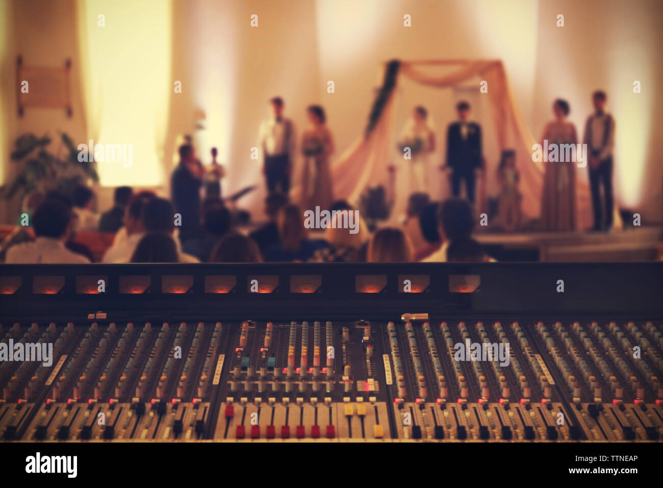Professional audio mixing console playing music on wedding ceremony ...