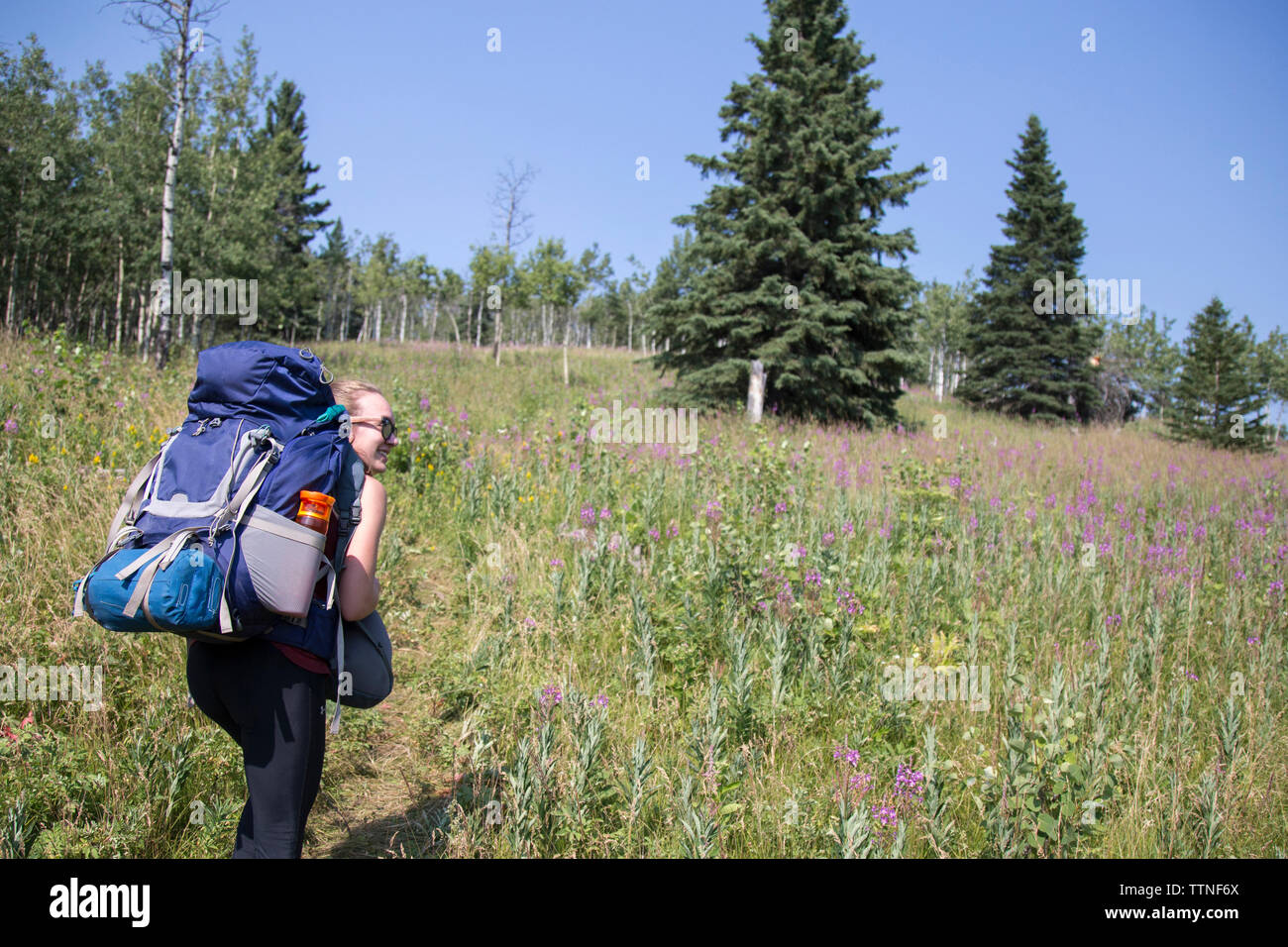 Woman backpack walking outdoors hi-res stock photography and images - Alamy