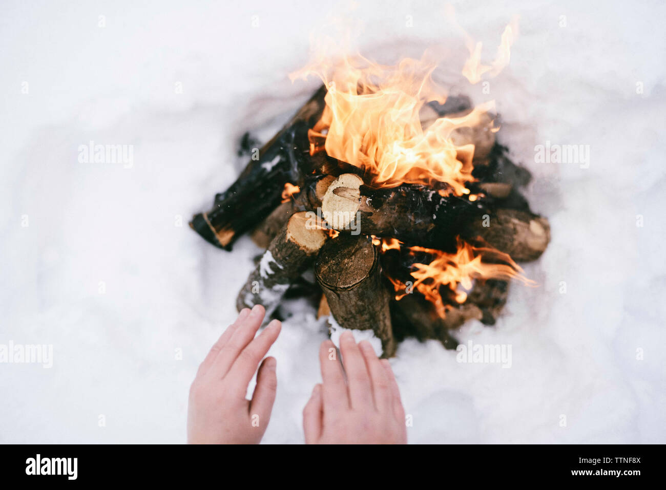 Warming hands by fire hi-res stock photography and images - Alamy