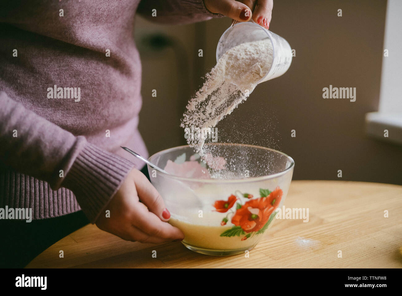 Mature woman mixing flour hi-res stock photography and images - Alamy