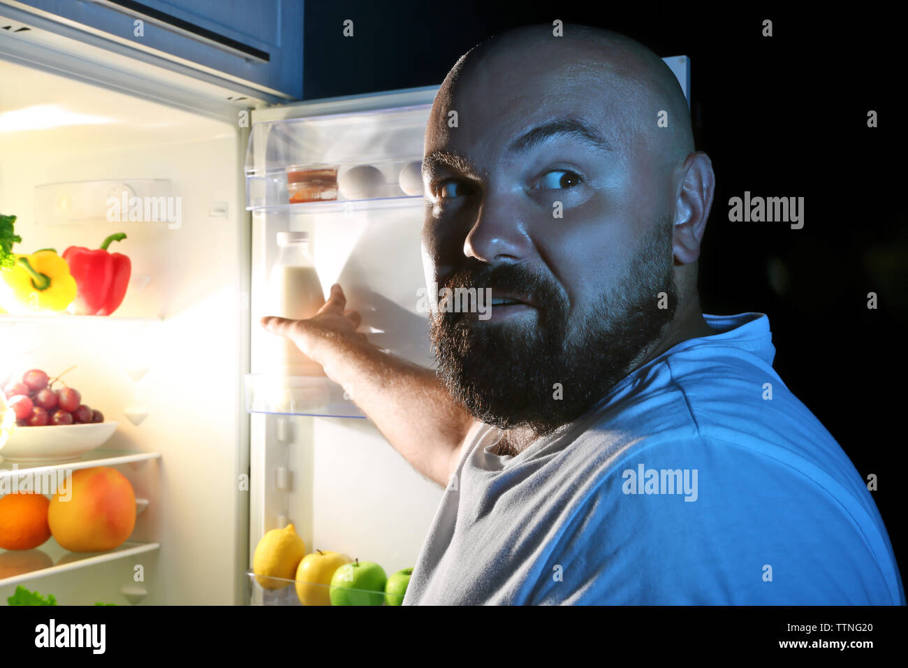 Man refrigerator open midnight hi-res stock photography and images - Alamy
