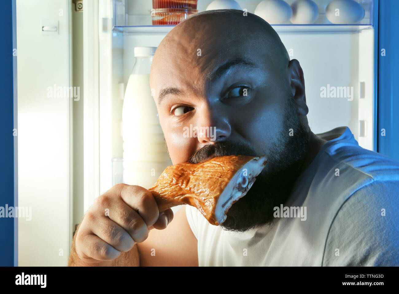 Refrigerator night man hi-res stock photography and images - Alamy