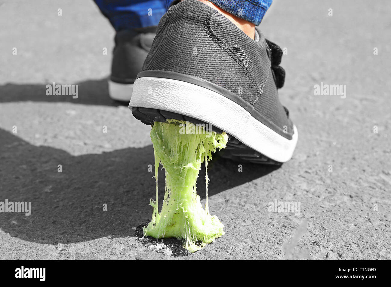 Foot stuck into chewing gum on street Stock Photo - Alamy