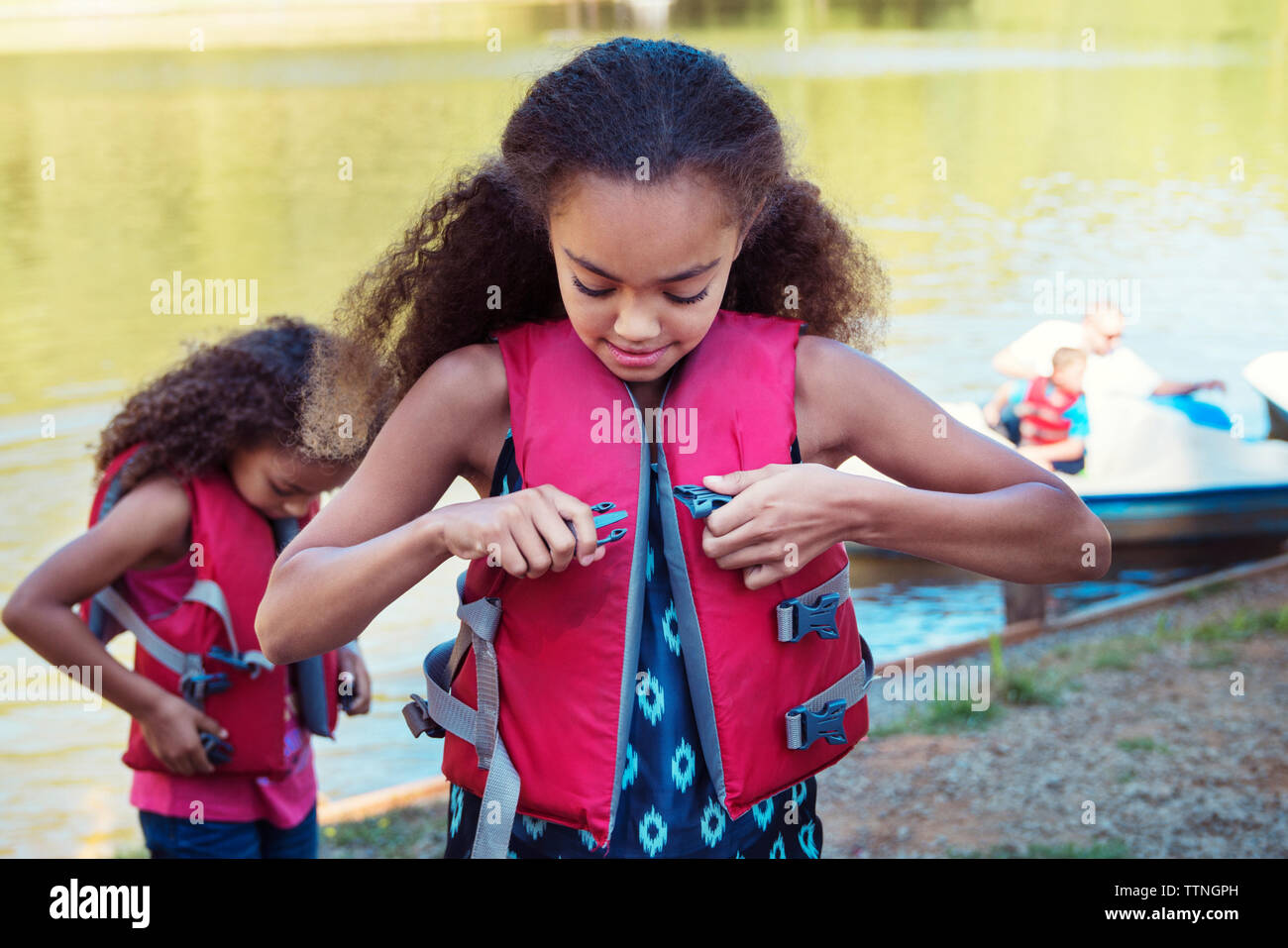 People wearing life jackets hi-res stock photography and images - Alamy