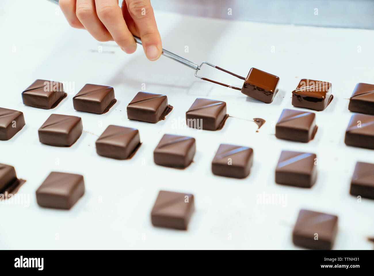 Chocolates hand hi-res stock photography and images - Alamy