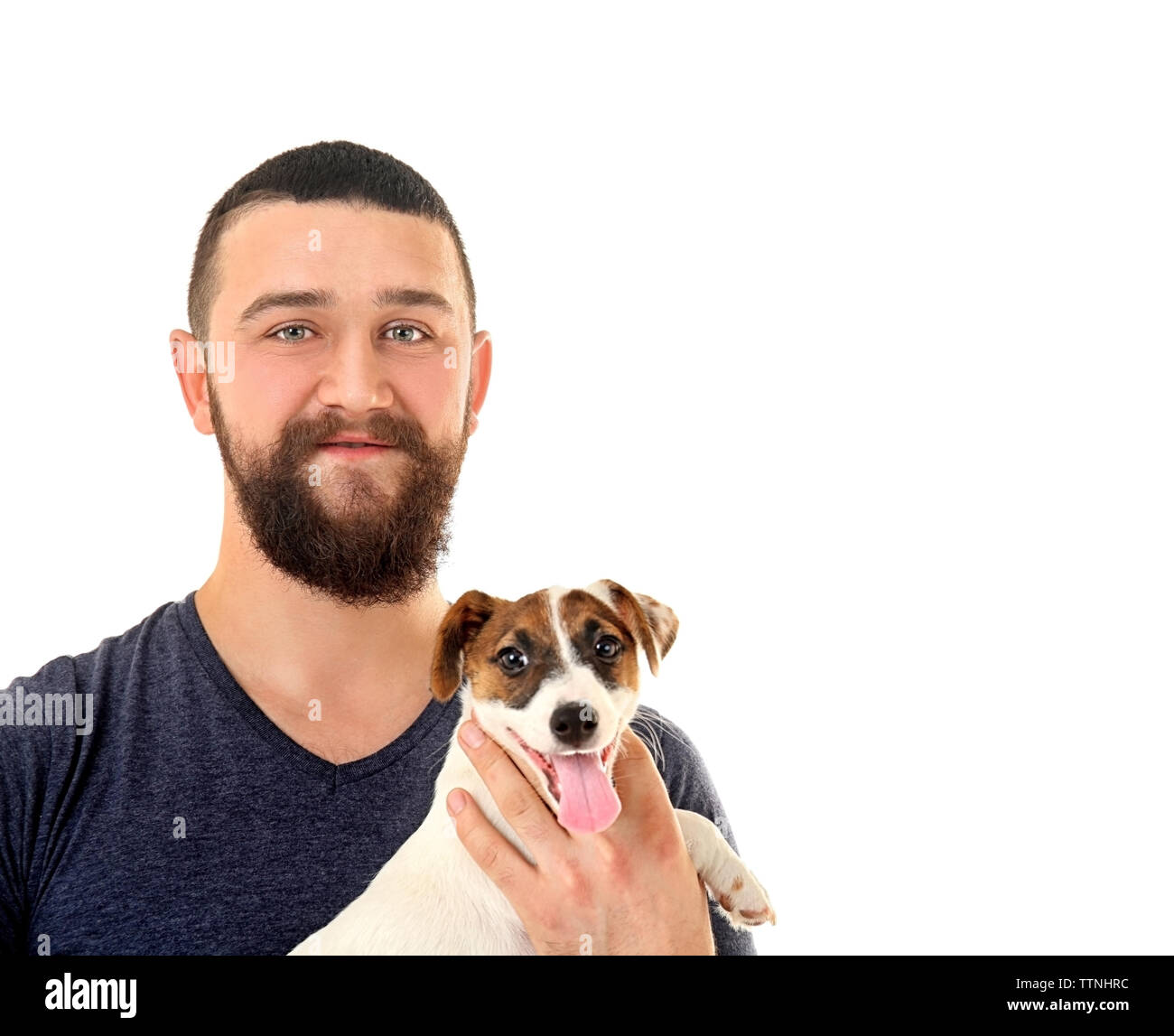 Handsome man with cute dog, isolated on white Stock Photo - Alamy