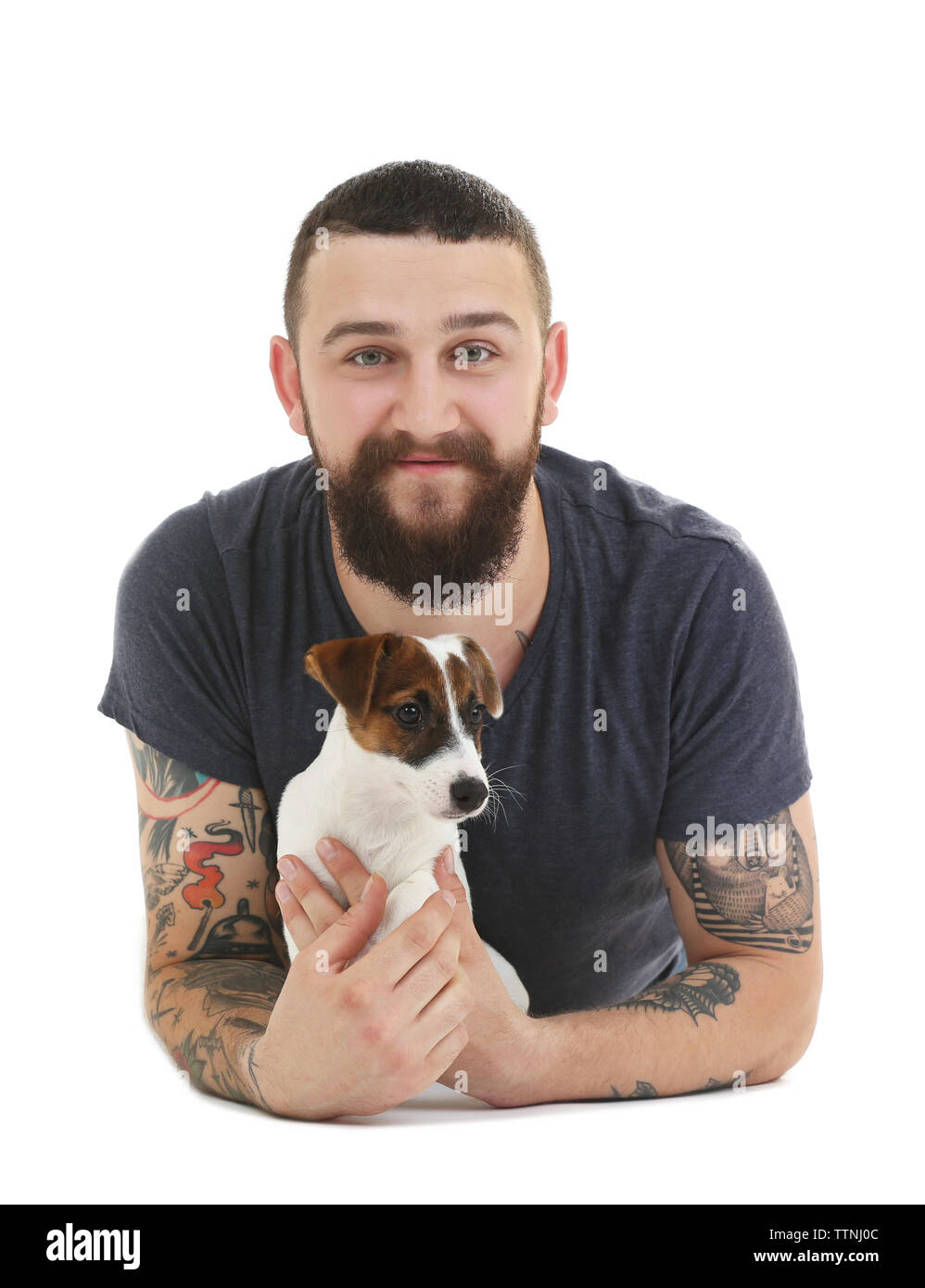 Man lying with dog Cut Out Stock Images & Pictures - Alamy