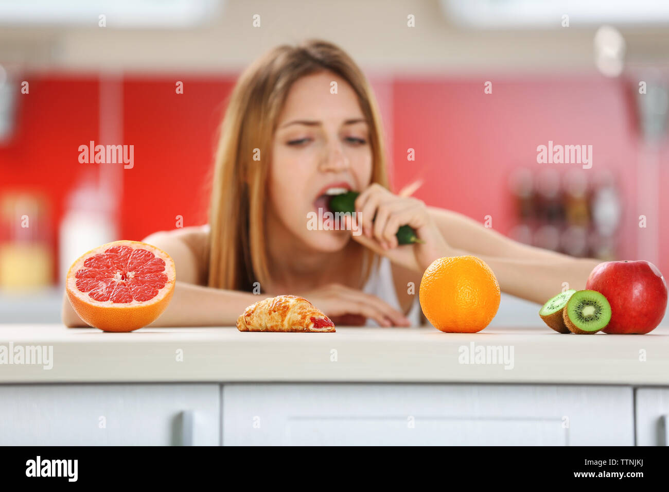 Woman eating cucumber hi-res stock photography and images - Alamy