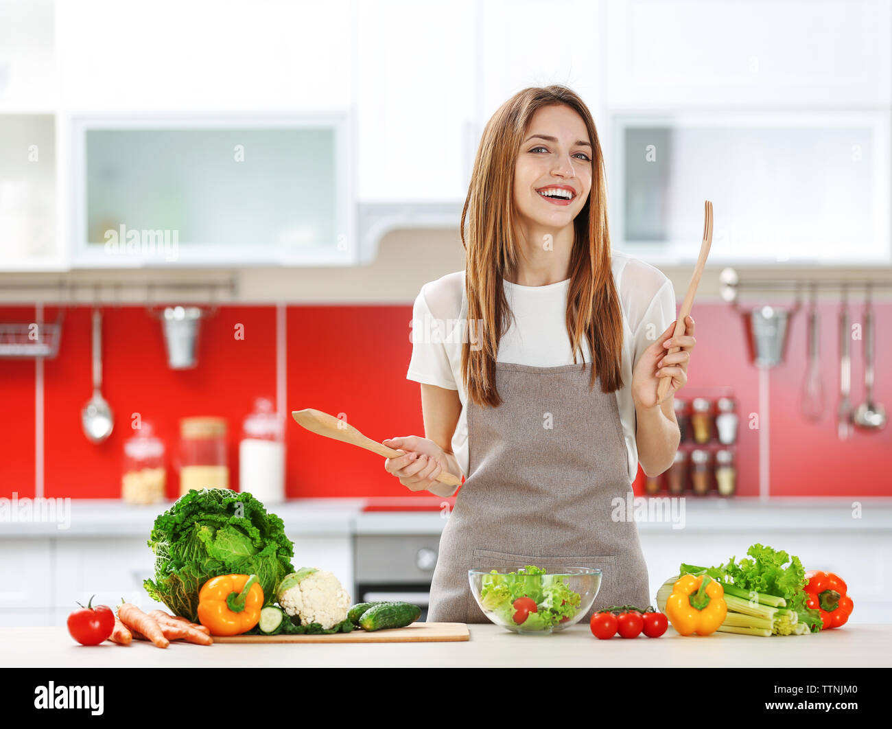 Woman cooking healthy food in the kitchen Stock Photo - Alamy