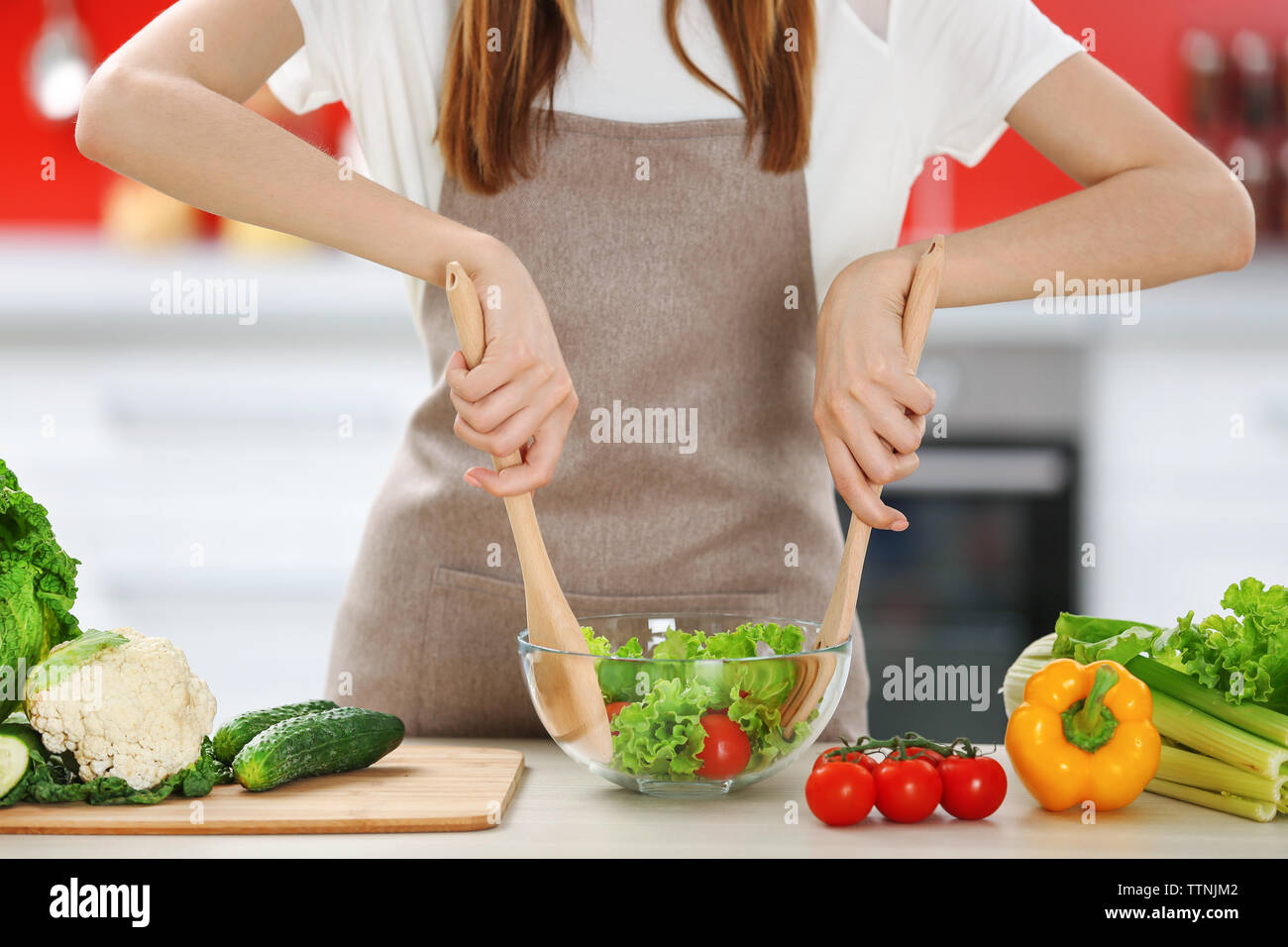 Woman cooking healthy food in the kitchen Stock Photo - Alamy