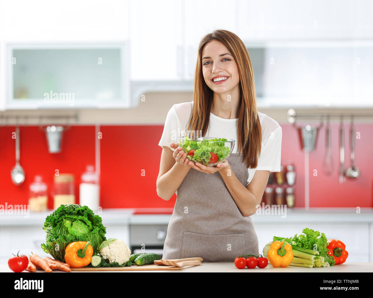 Woman cooking healthy food in the kitchen Stock Photo - Alamy