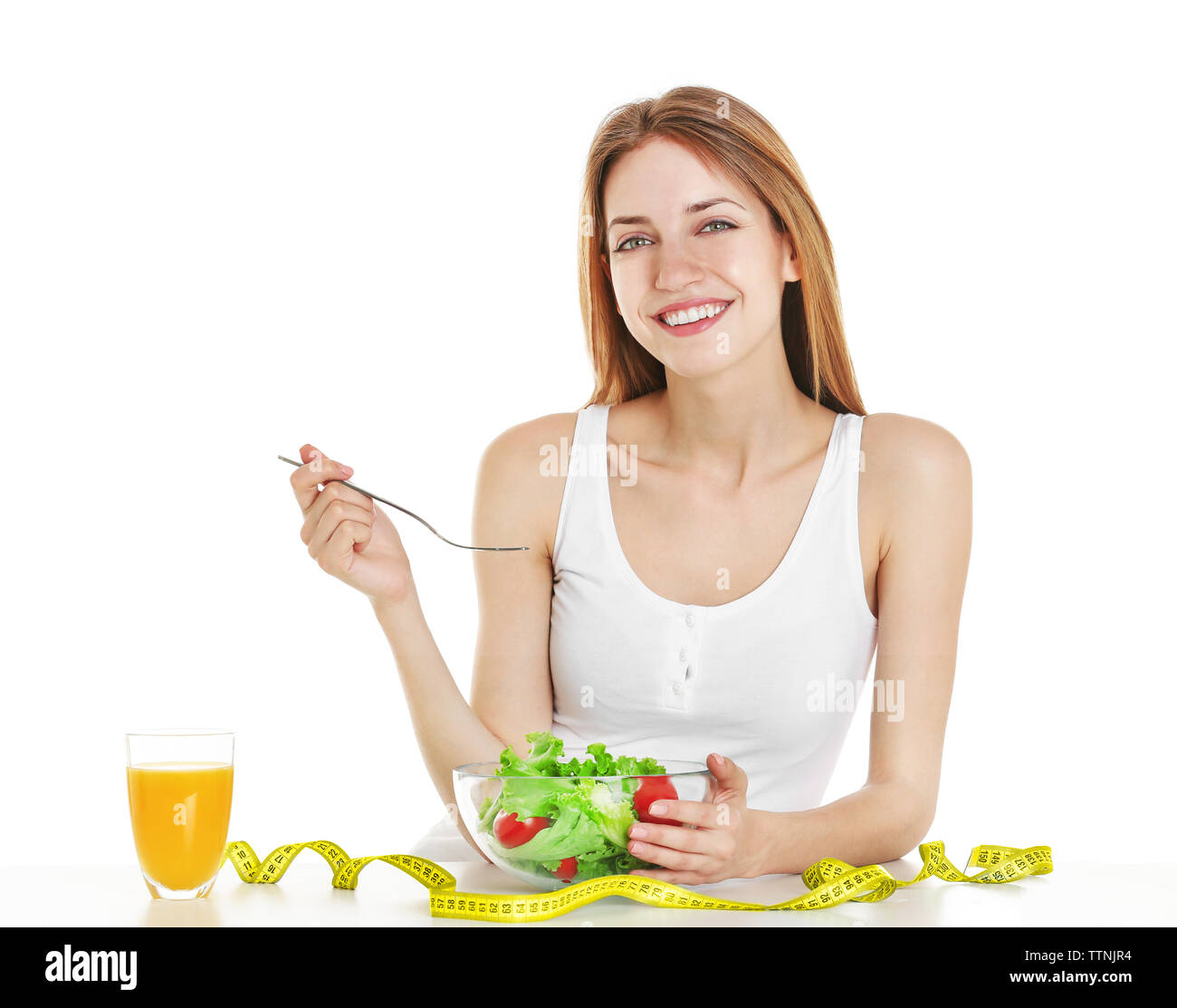 Woman eating salad measuring hi-res stock photography and images - Alamy