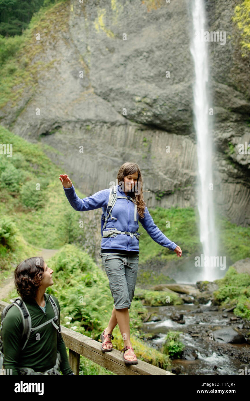 Blurred young couple walking with backpacks in countryside Stock Photo ...