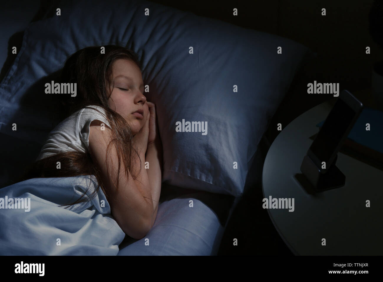 Cute sleeping girl in bed Stock Photo - Alamy