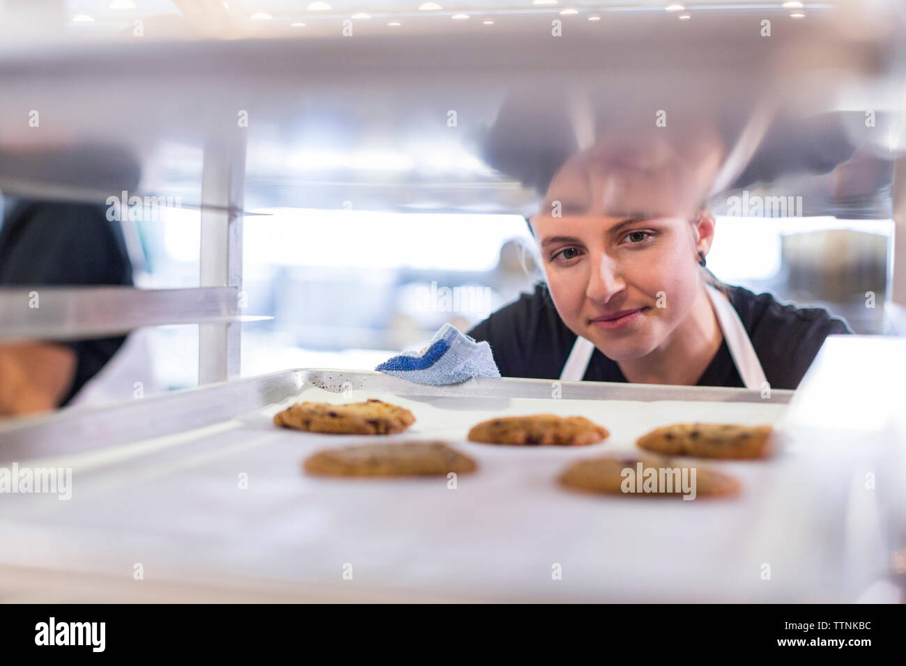 Female chef making cookies at restaurant kitchen Stock Photo - Alamy