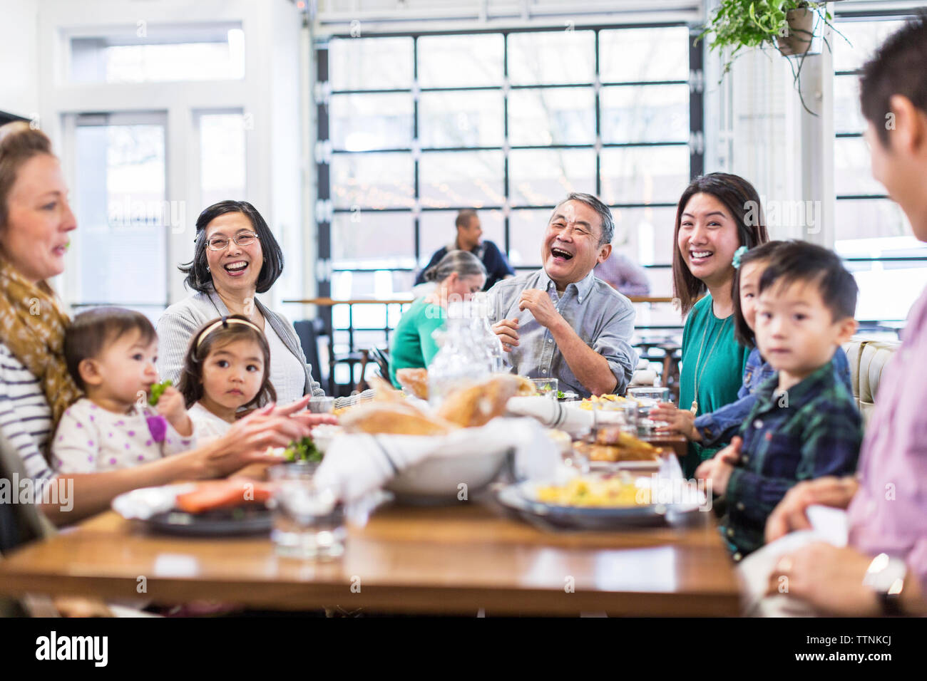 Indian family having lunch together hi-res stock photography and images ...