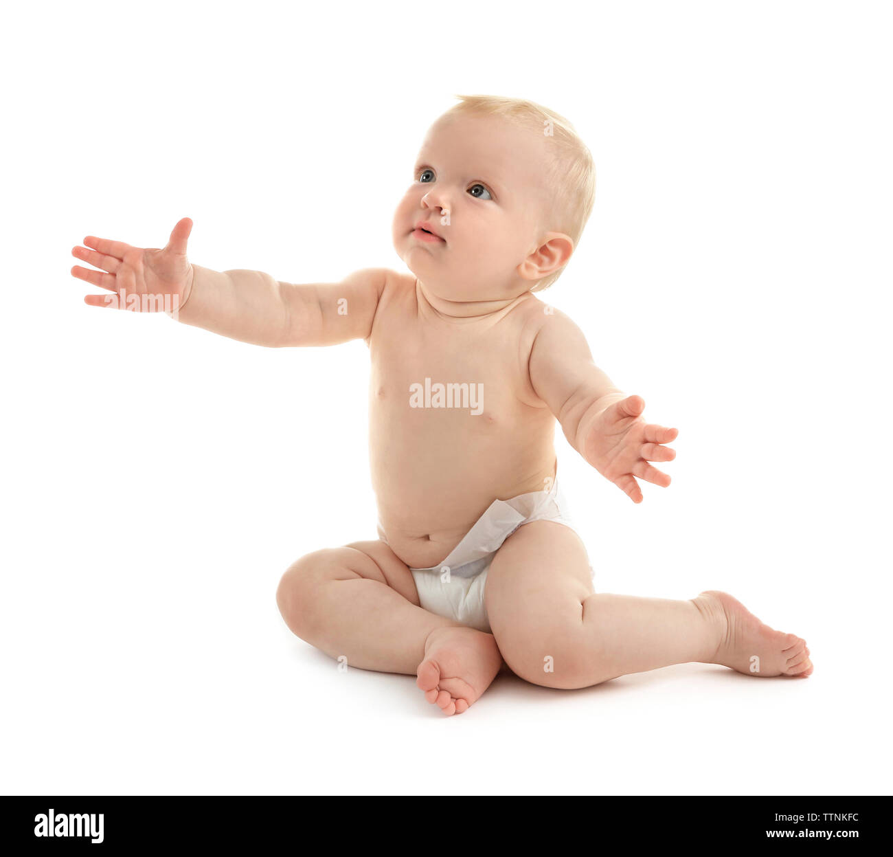 Baby sitting on white background Stock Photo - Alamy