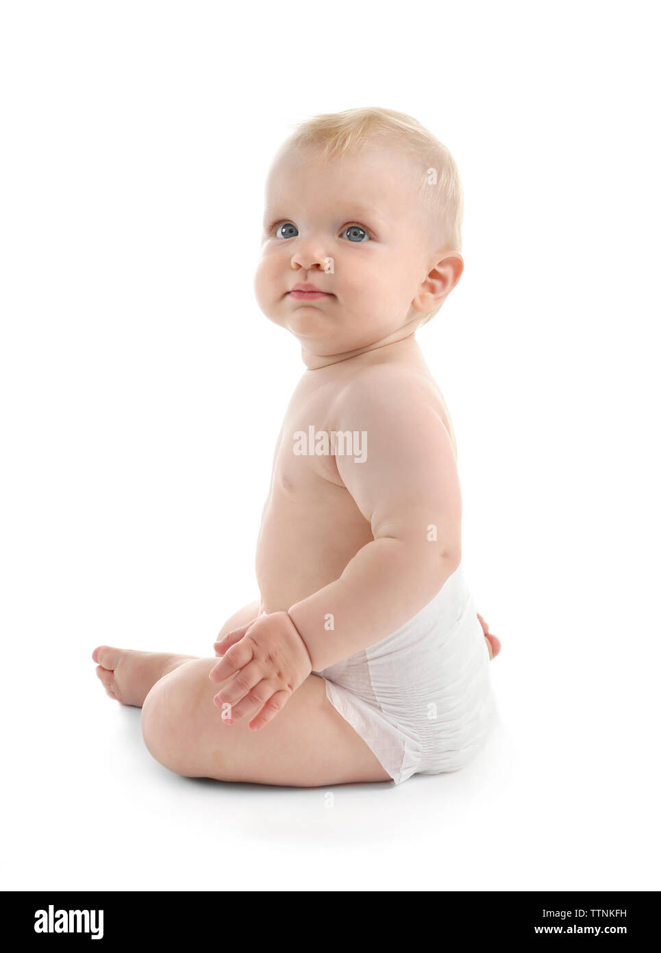 Baby sitting on white background Stock Photo - Alamy