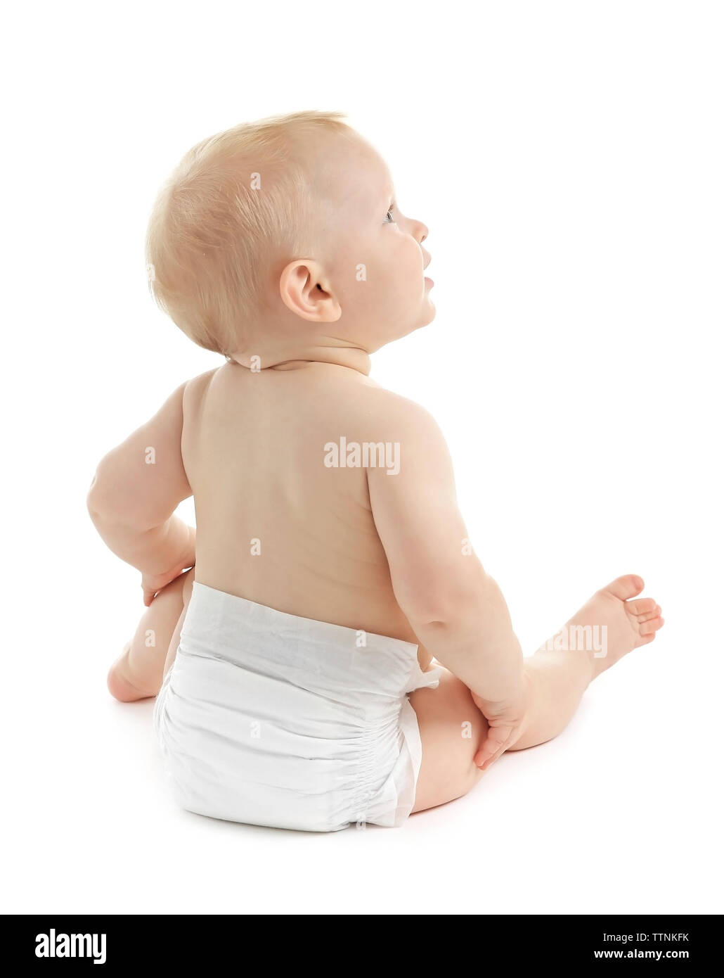 Baby sitting on white background Stock Photo - Alamy
