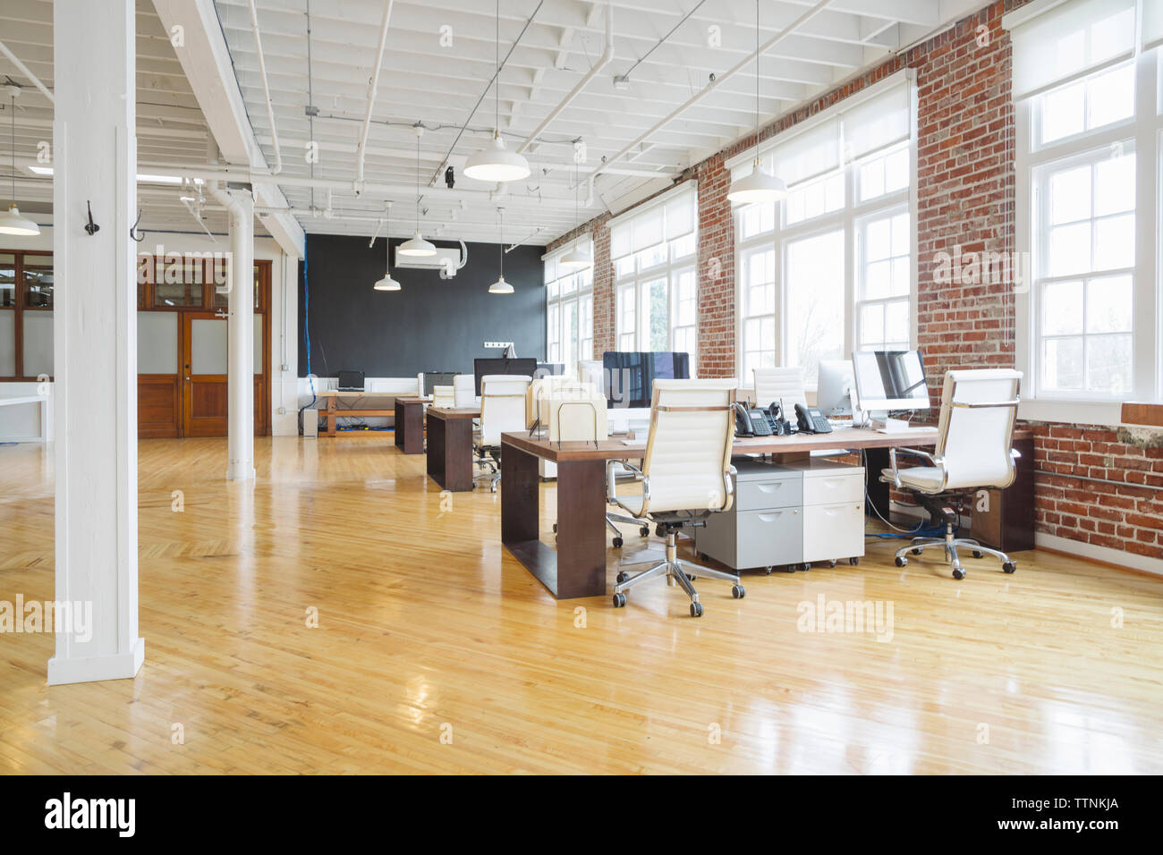 Interior of office with furniture and desktop computers Stock Photo - Alamy