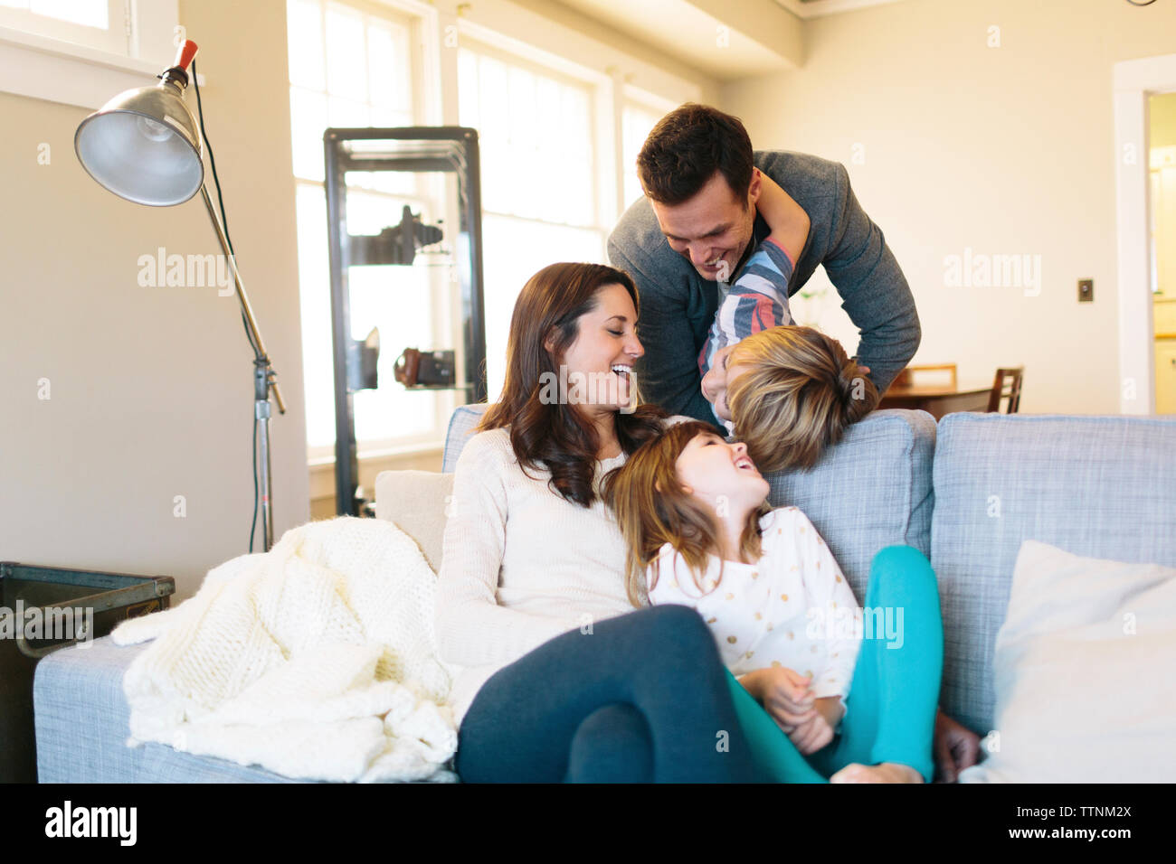 Happy children with parents at home Stock Photo - Alamy