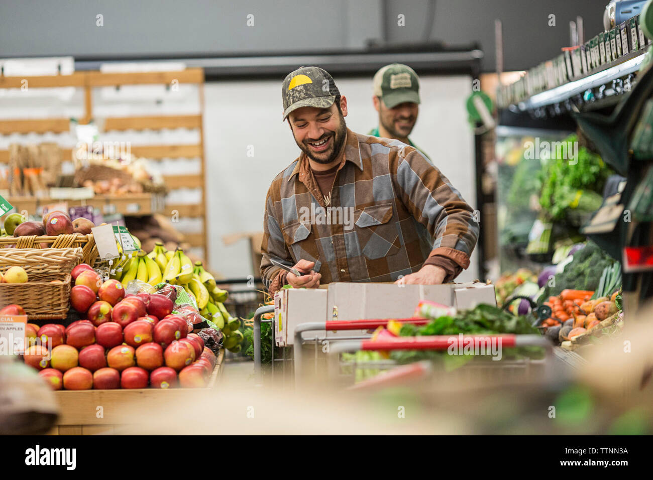 Male workers working at supermarket Stock Photo - Alamy