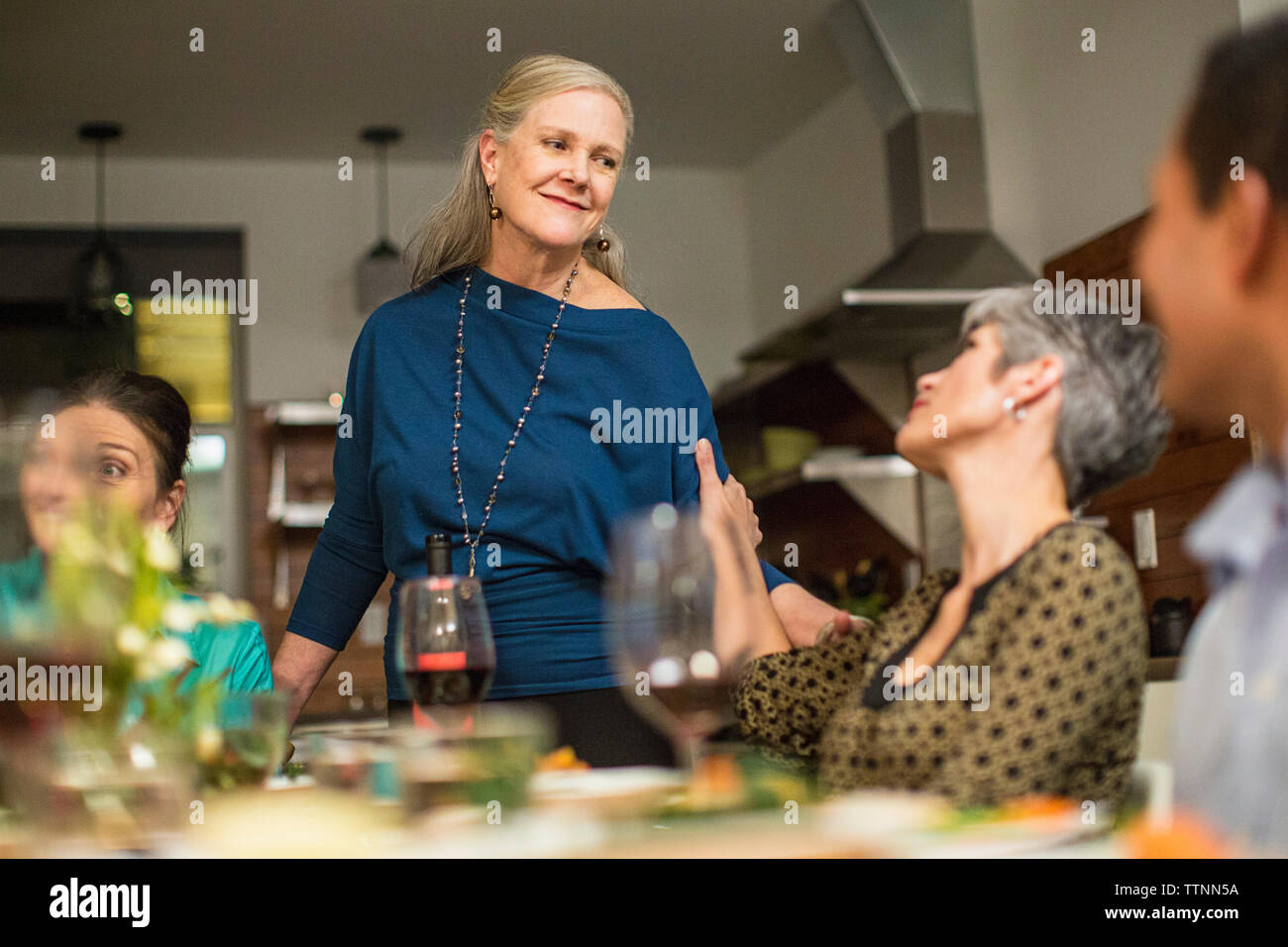 Happy friends during social gathering at home Stock Photo - Alamy