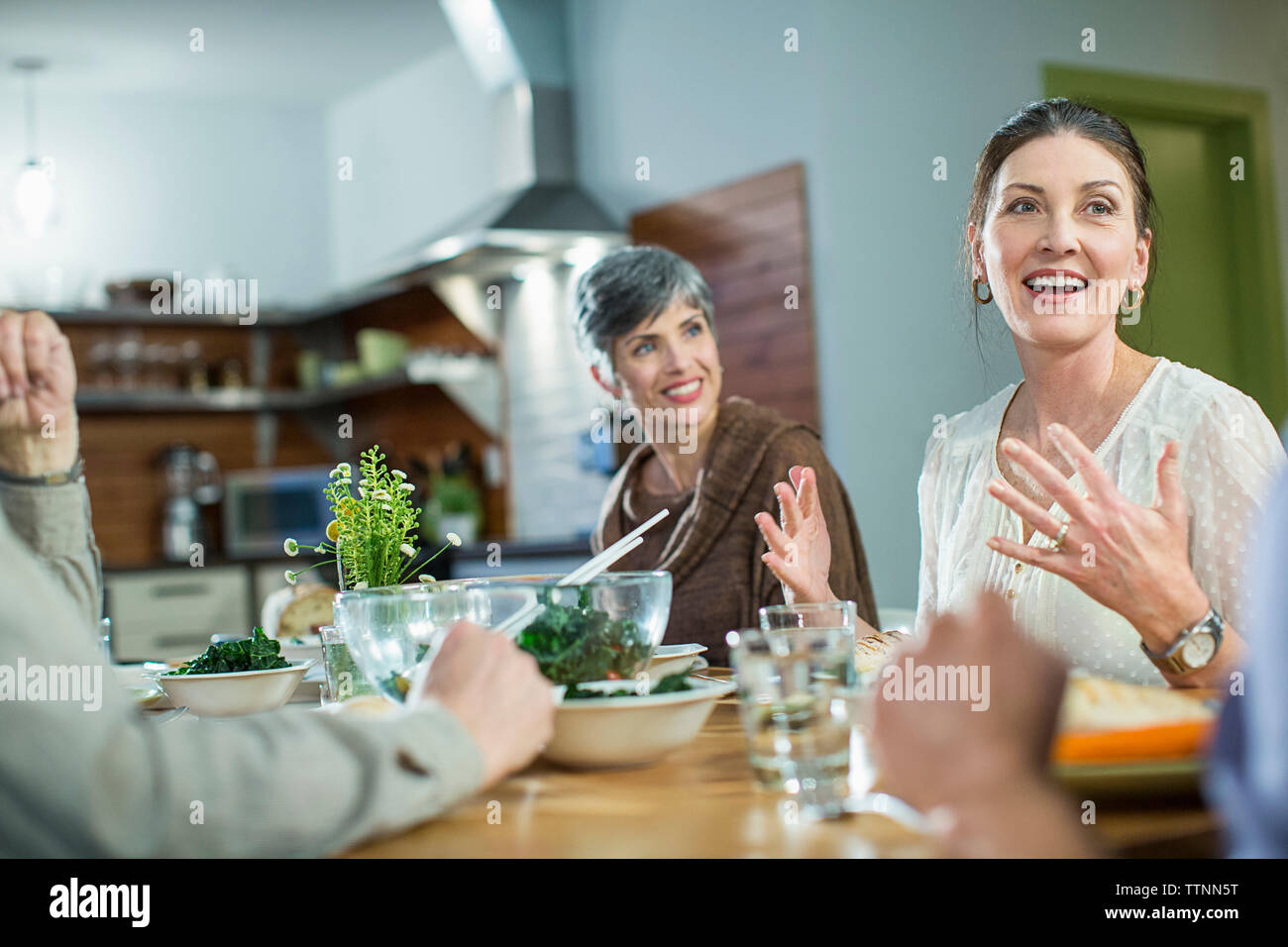 Females talking during meal hi-res stock photography and images - Alamy